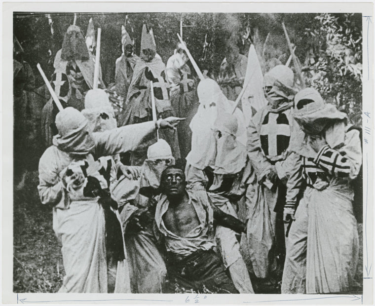 Klansmen surround freedman Gus (played by white actor Walter Long in b ...